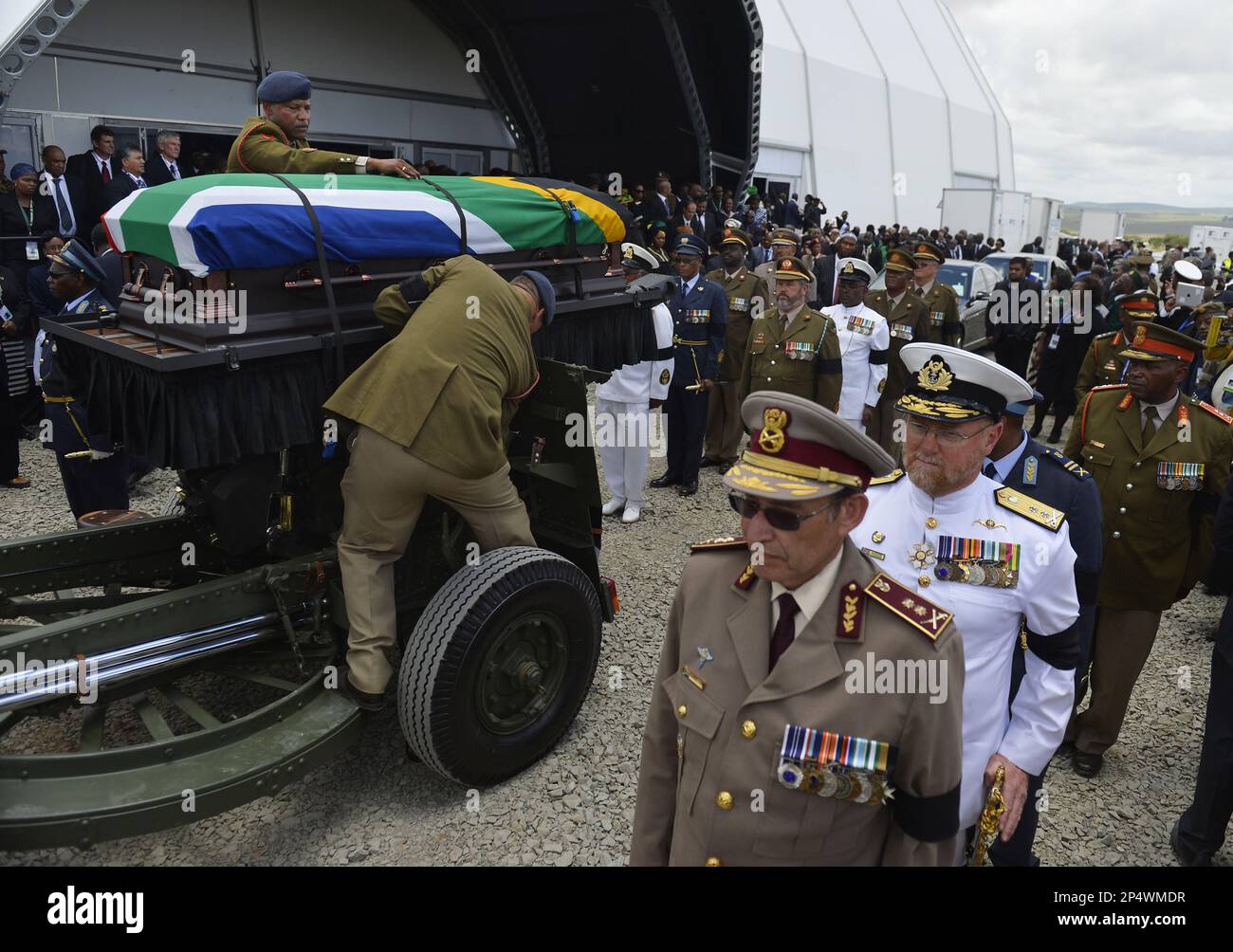 Soldiers place former South African President Nelson Mandela's casket ...