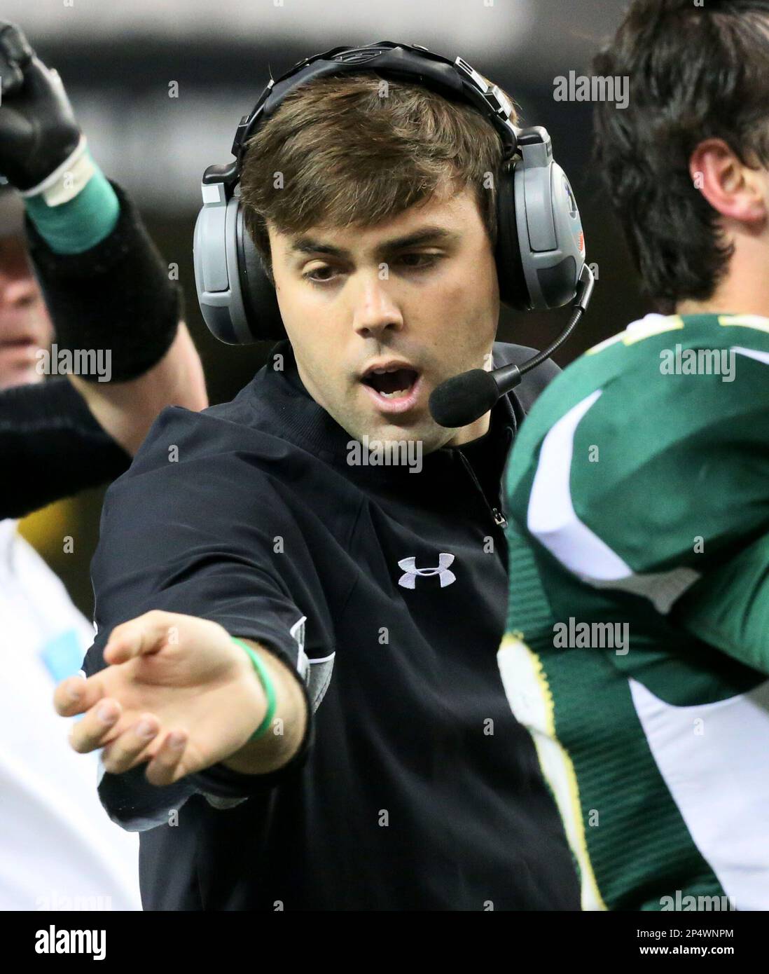 Aquinas High School head coach James Leonard directs his players ...
