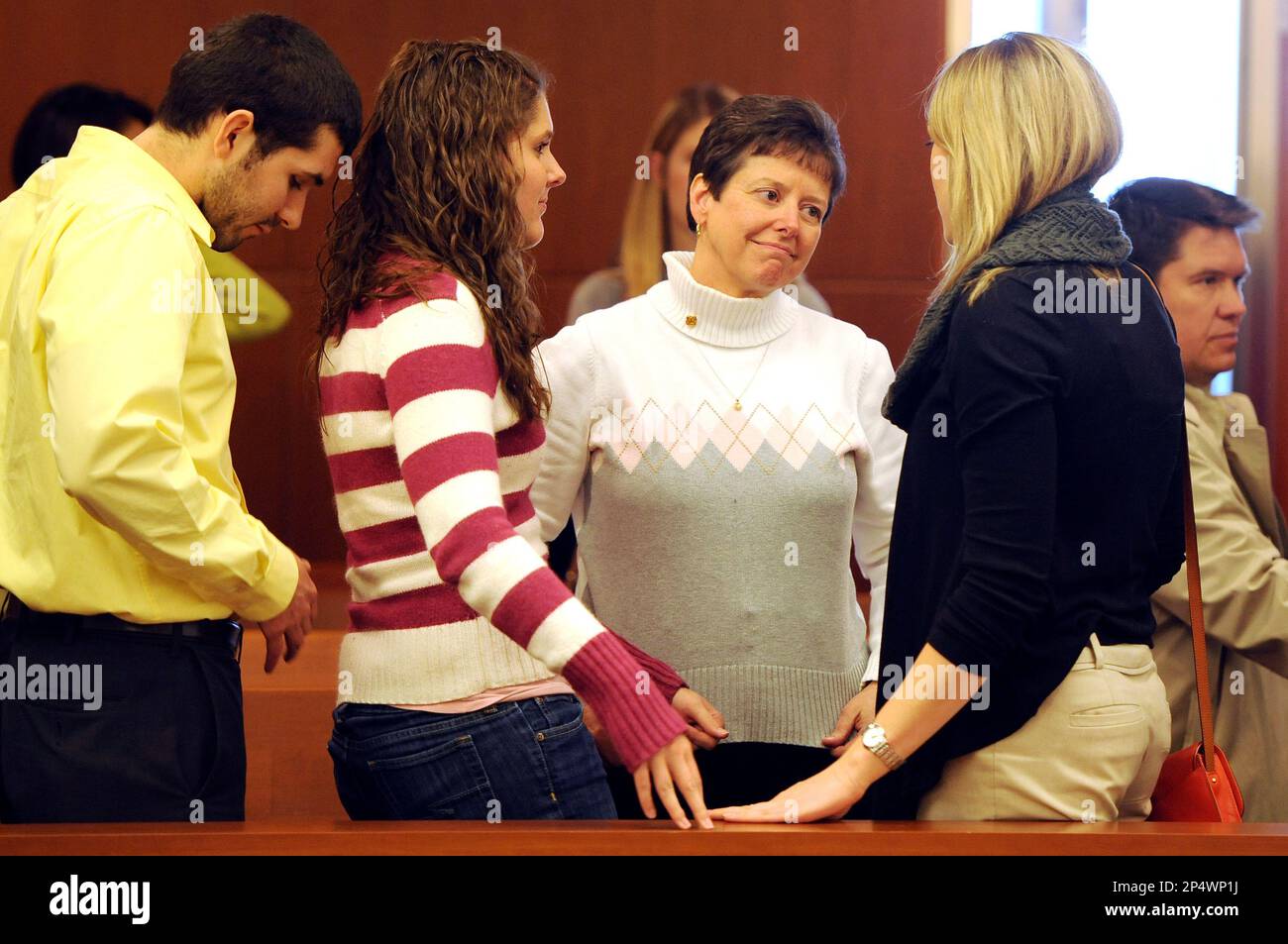 From left, Joseph Duratinski and Rebekah DeWolf, look on as Kris DeWolf ...