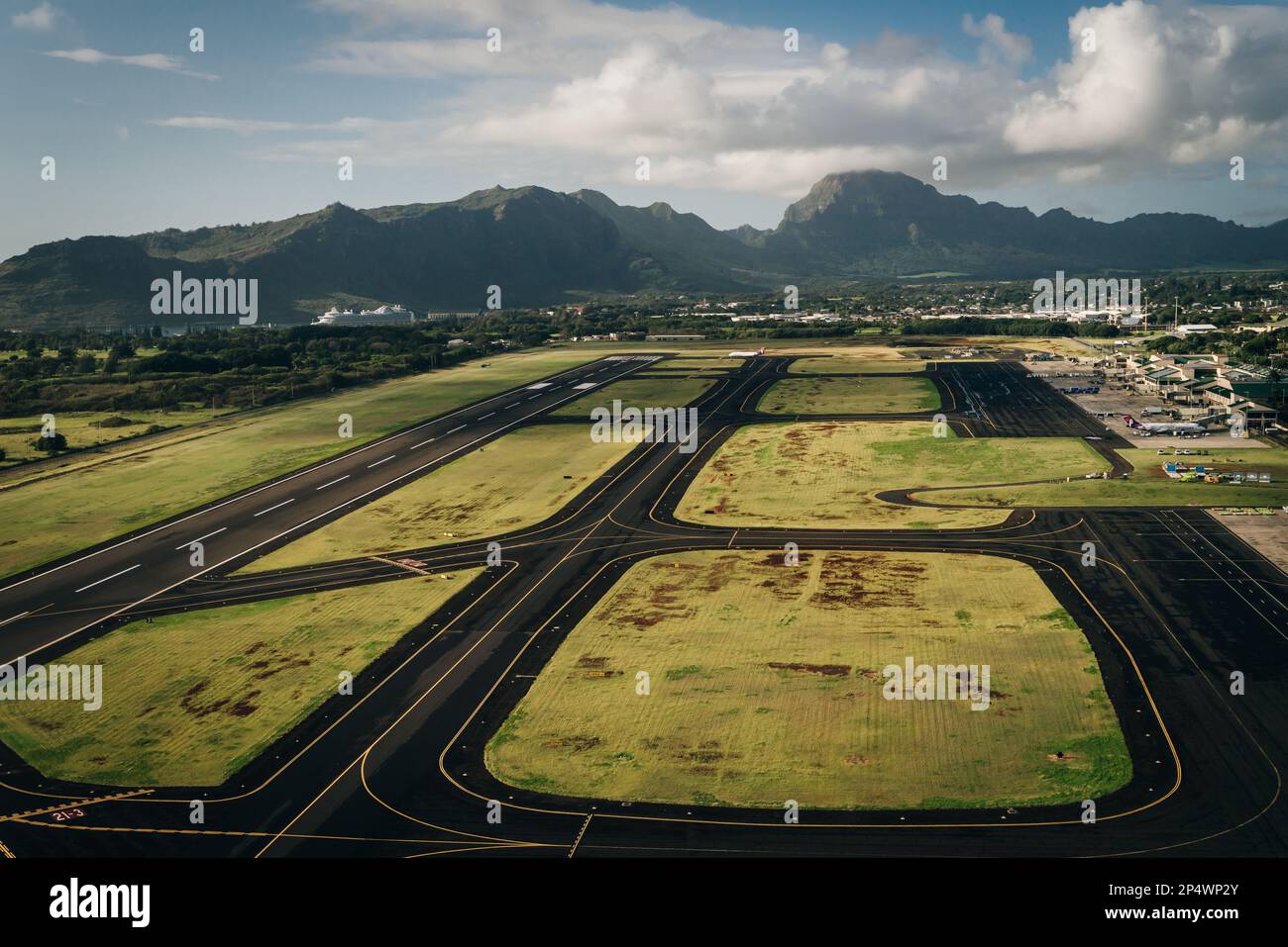 Aerial view of the runway and plane hangars of Lihue airport on Kauai ...