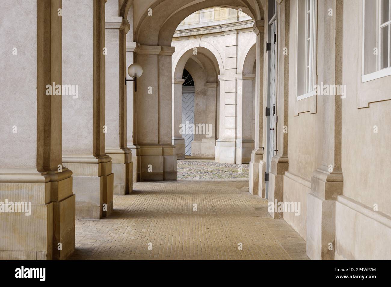 Diminishing perspective view between outdoor arch corridor of ...