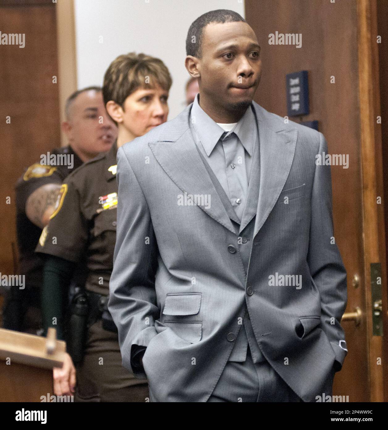 Michael D. Lawrence, 24, enters the courtroom for his trial with Rico A ...