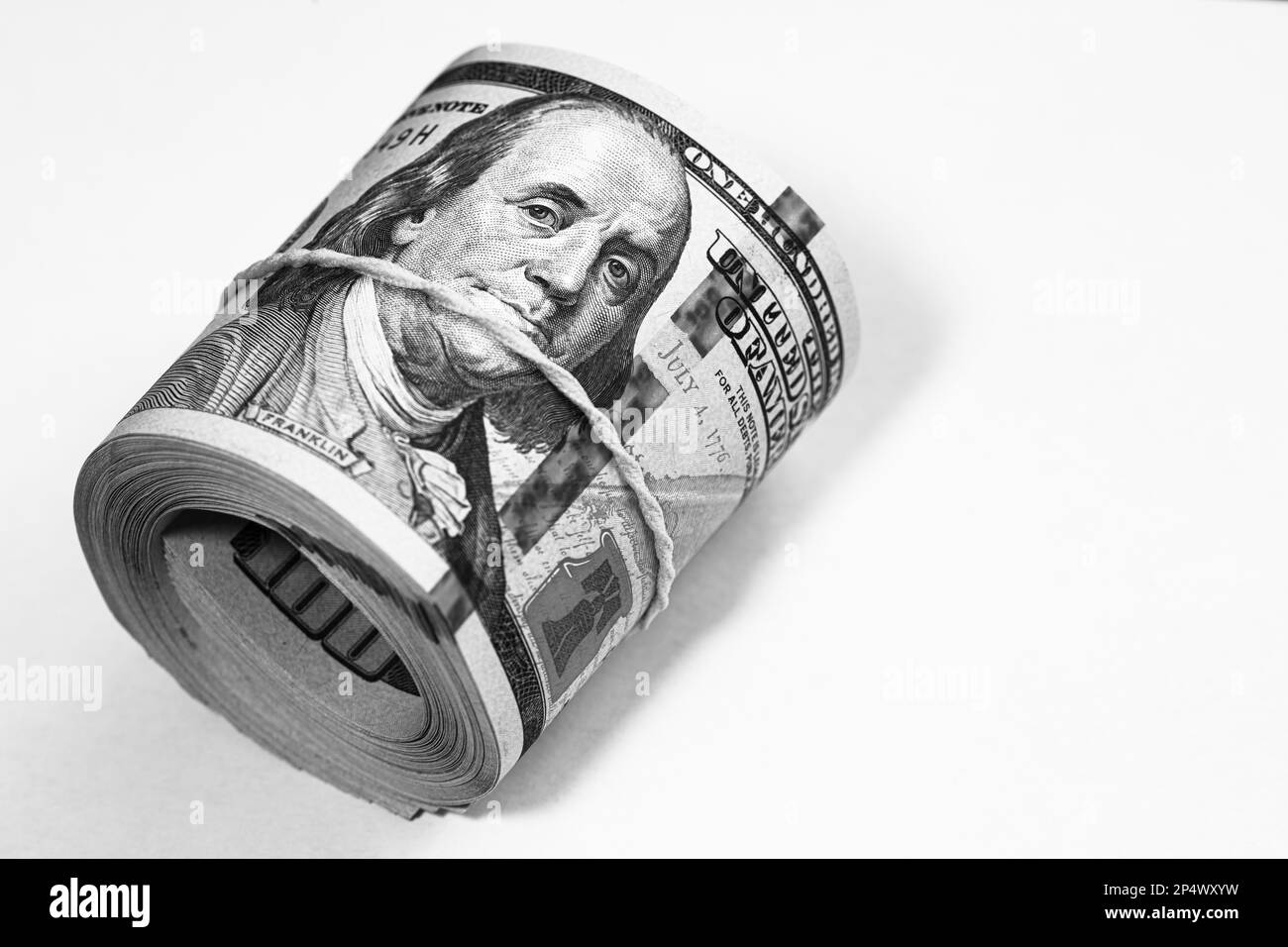 roll of 100 dollar banknotes on white background for design purpose ...