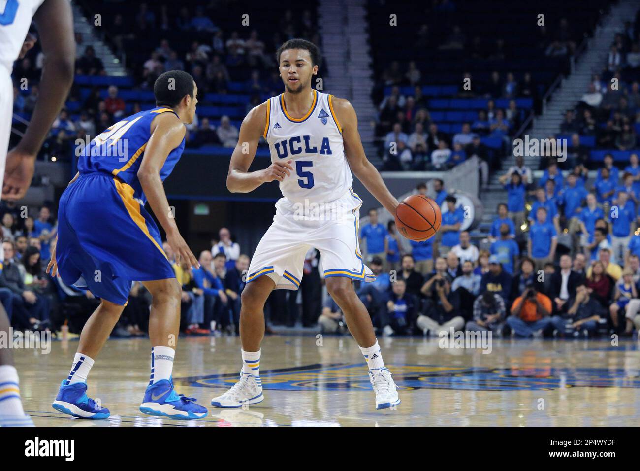 Kyle Anderson of the UCLA Bruins is guarded by Michael Bryson of the UC ...
