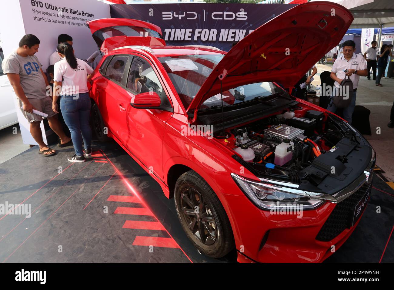 Yangon, Myanmar. 2nd Mar, 2023. Visitors look at a BYD e2 battery ...