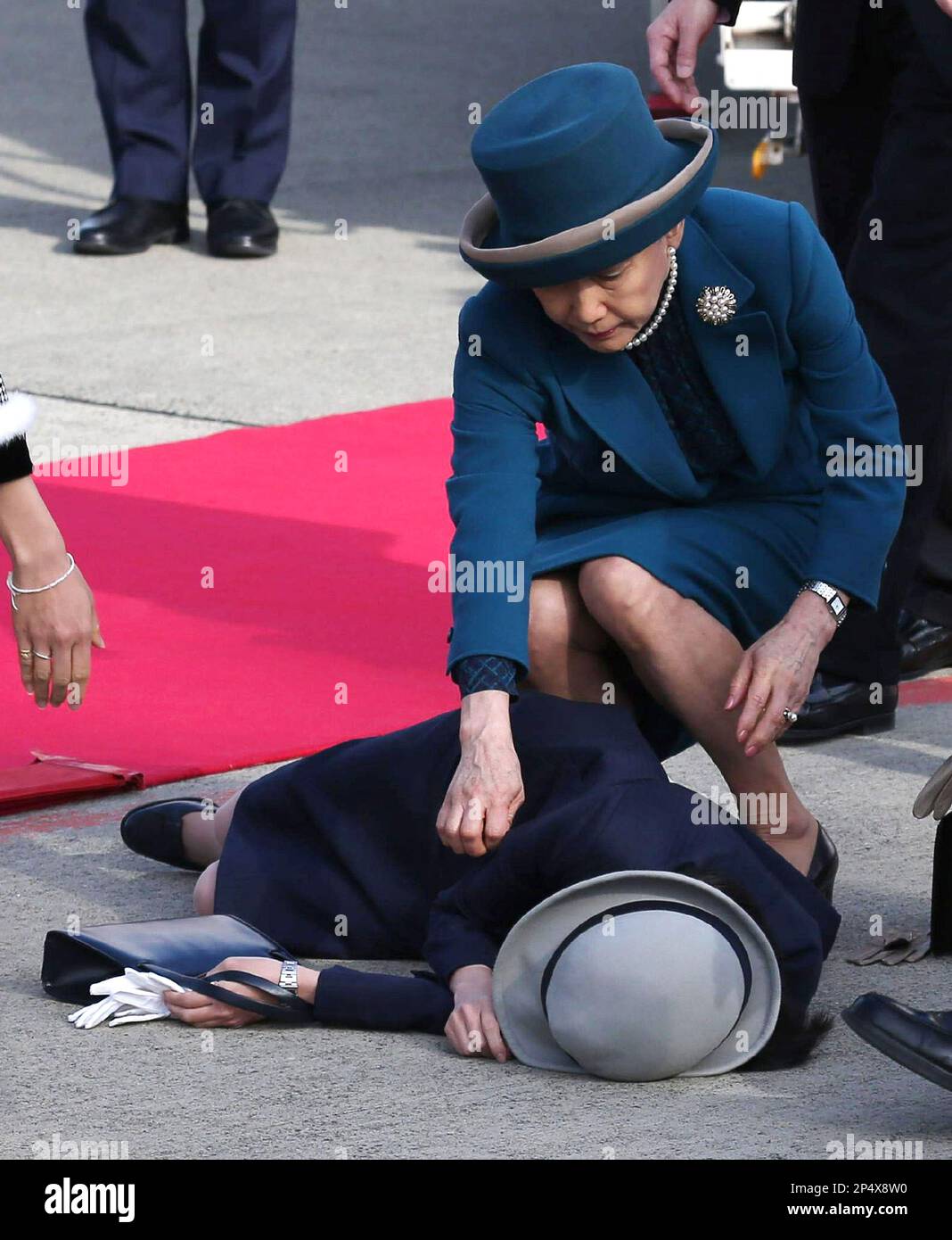 Japan's Princess Akiko of Mikasa falls down on a ground during a ...