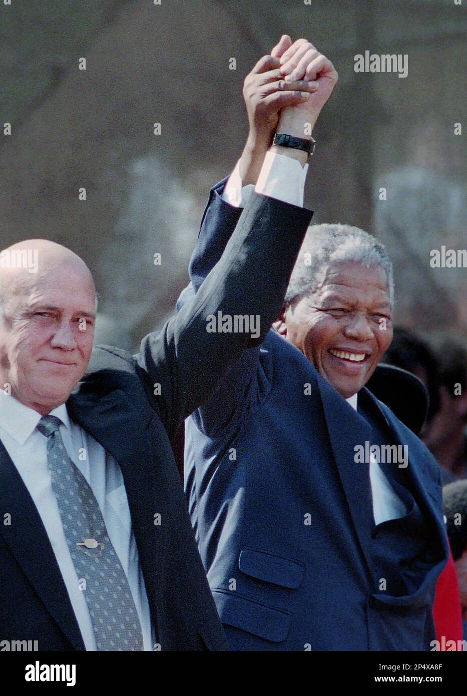 This file photo from 1994 shows newly election South African president Nelson Mandela holding ...