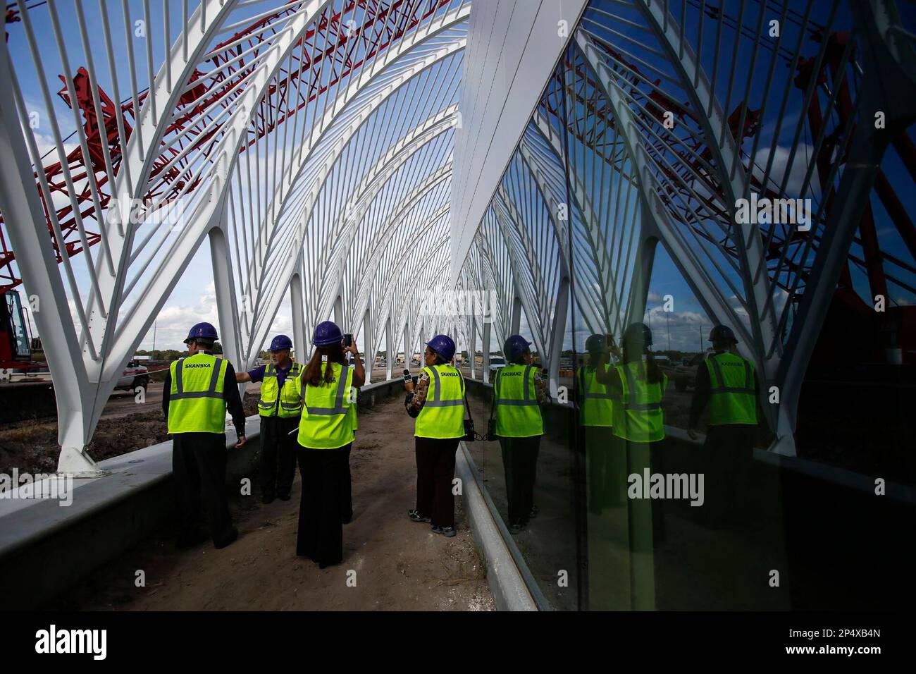 Members of the media tour Florida Polytechnic University's IST Building ...