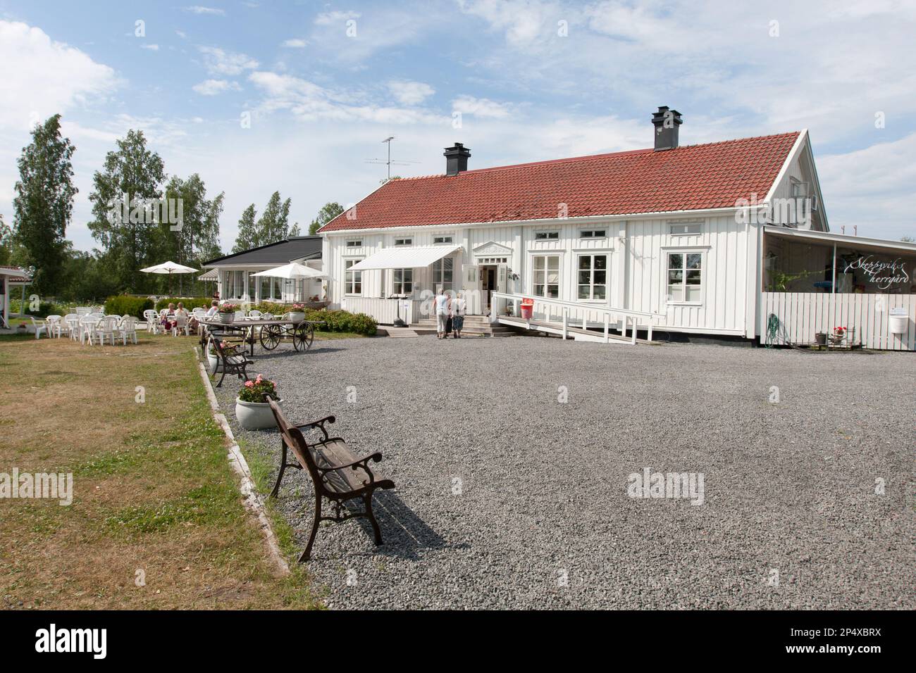 SKEPPSVIK, SWEDEN ON JULY 09, 2011. Summer restaurant with unidentified ...