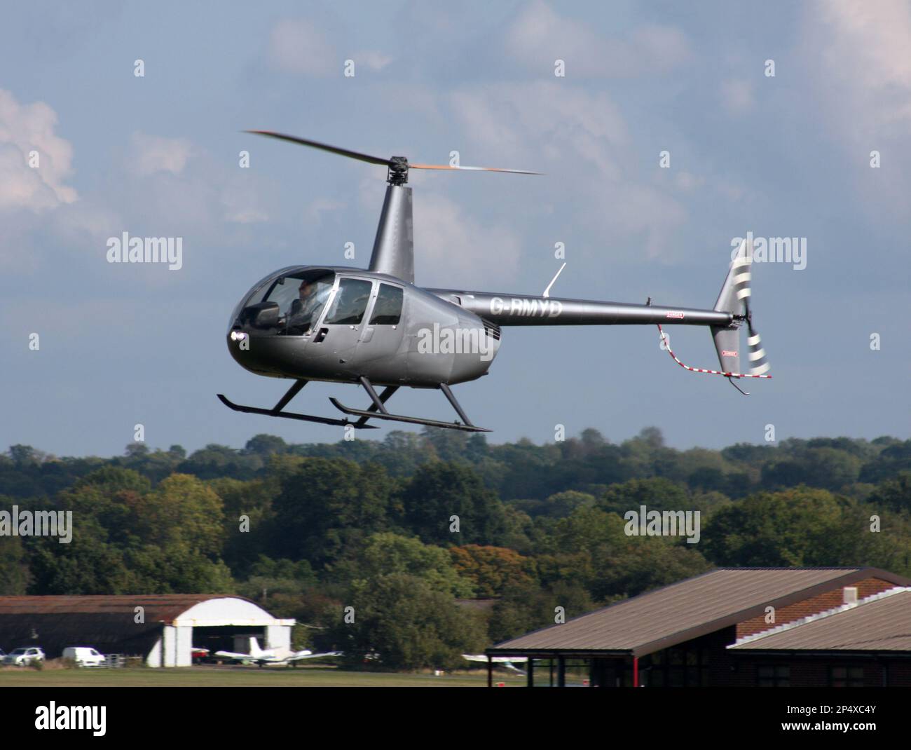 A Robinson R44 Raven helicopter arriving at Redhill Aerodrome Stock ...