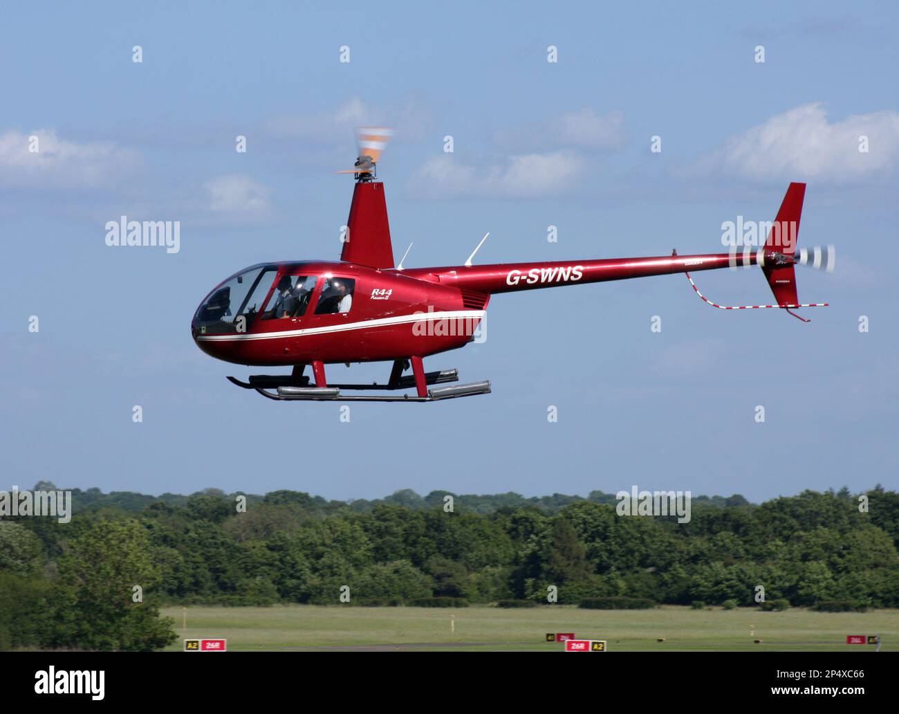 A Robinson R44 Raven II helicopter arrives a Redhill Aerodrome Surrey ...