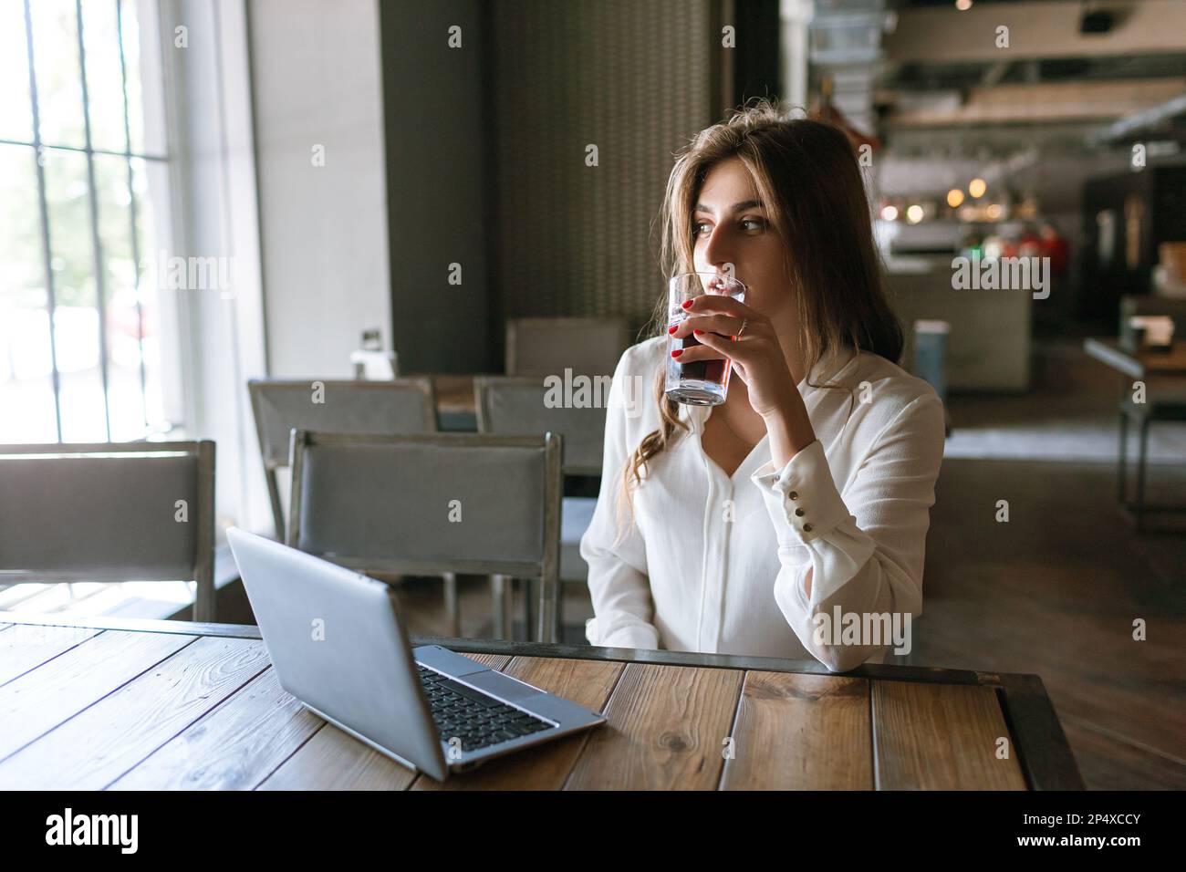 Lunch break during work. Thoughtful business lady Stock Photo - Alamy