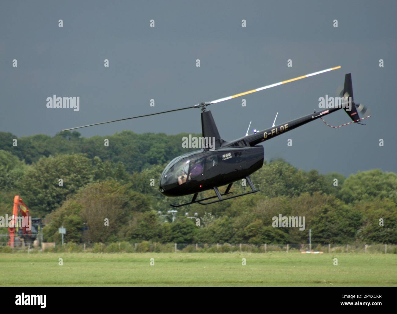 A Robinson R66 Turbine helicopter departs Brighton City Airport Sussex ...