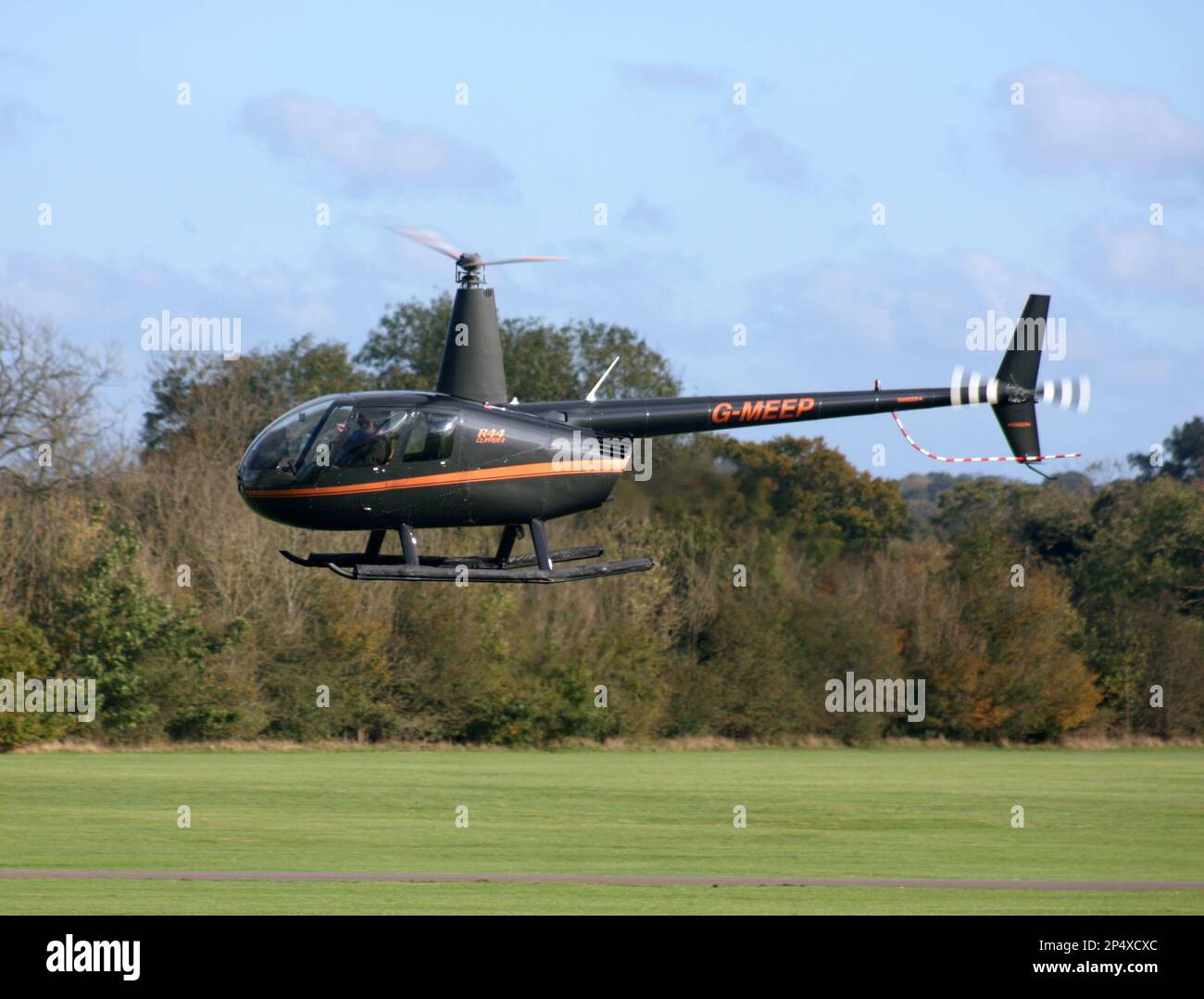 A Robinson R44 Clipper II helicopter arriving at Redhill Aerodrome Surrey England Stock Photo ...