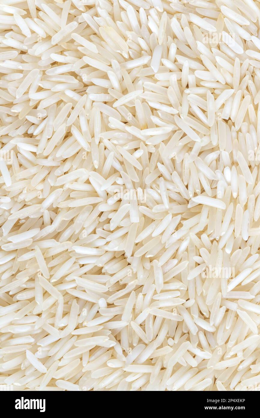 Basmati long white rice background, full frame Stock Photo - Alamy