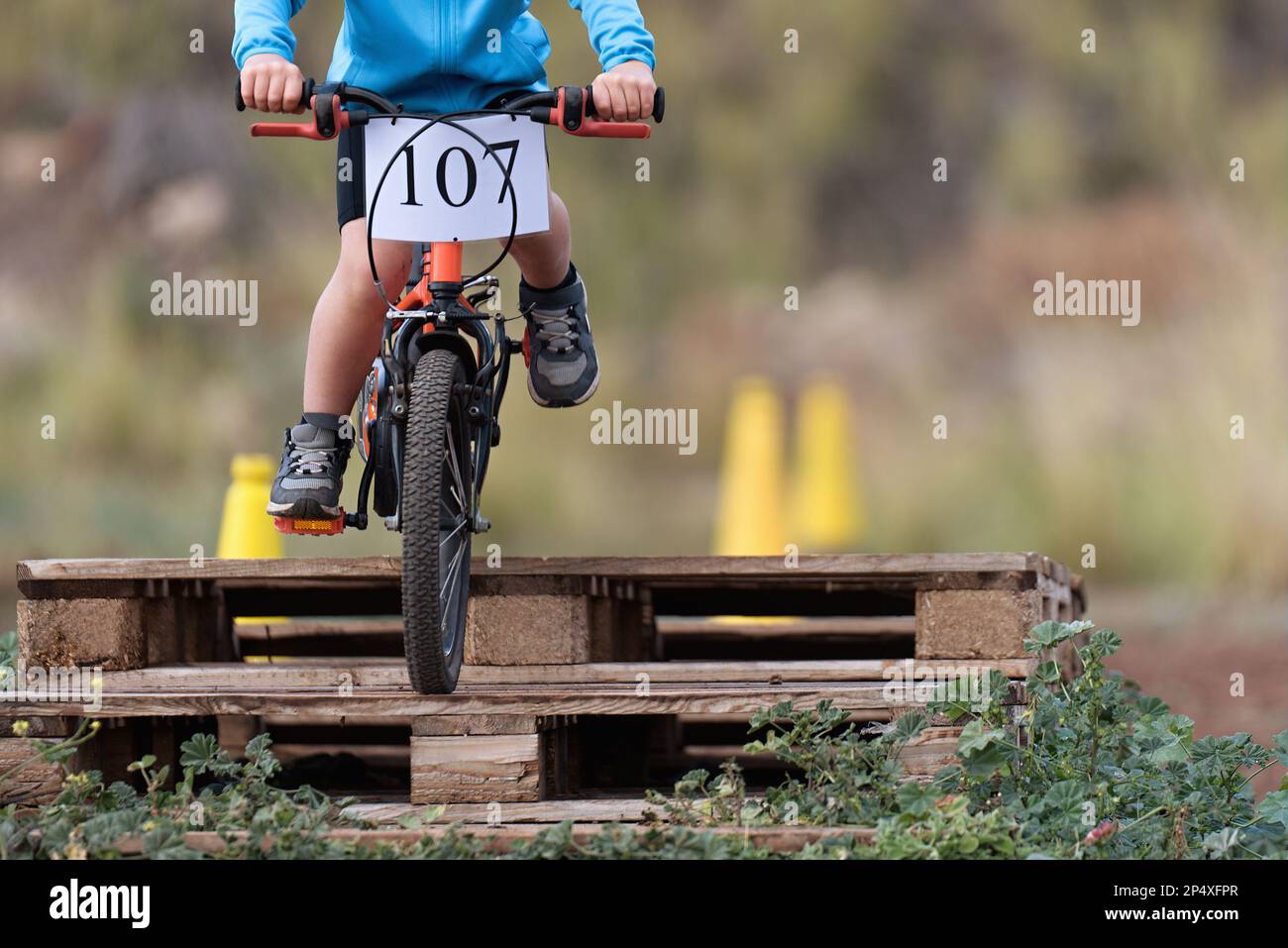 BMX rider competing in the child class, mountain bike hard trail Stock ...