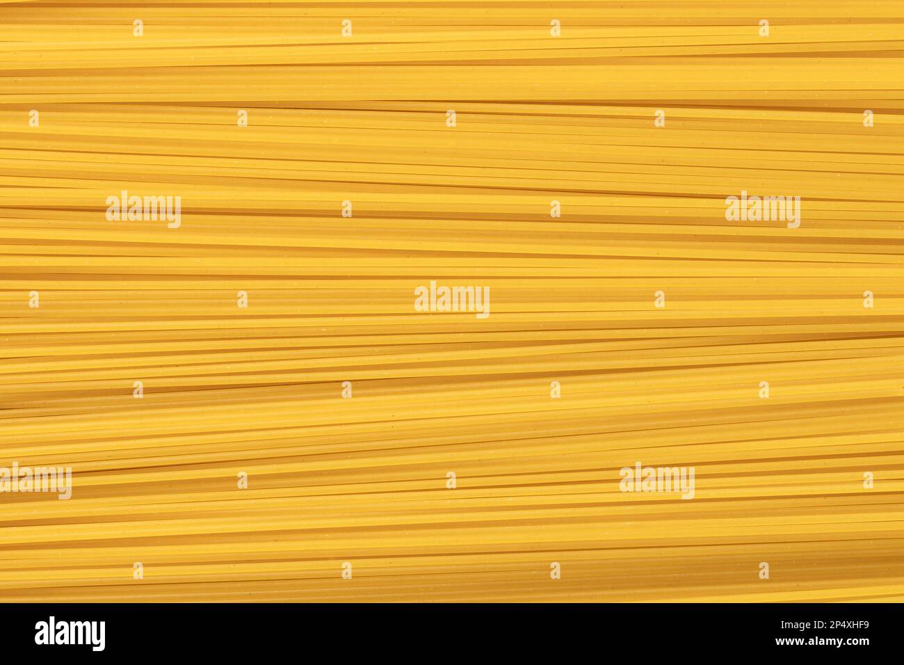 Closeup of raw spaghetti. Uncooked dry durum pasta.Full frame of ...