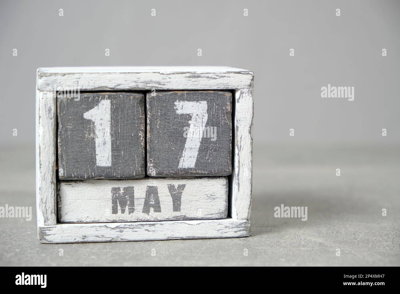 May 17 calendar made wooden cubes gray background.With an empty space ...