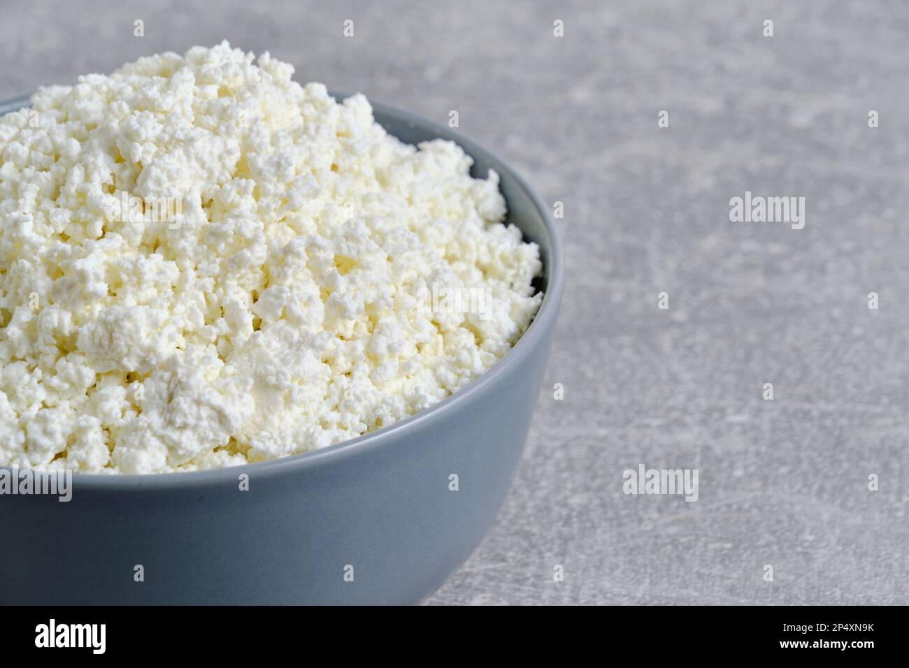 Plate with homemade cottage cheese gray concrete background Stock Photo ...