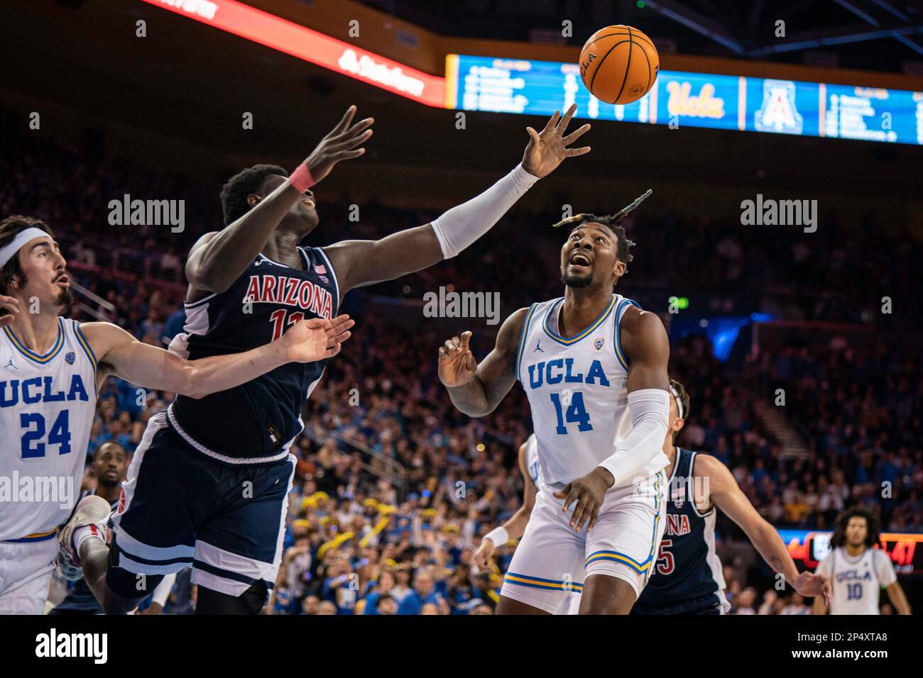 UCLA Bruins forward Kenneth Nwuba (14) and Arizona Wildcats center ...