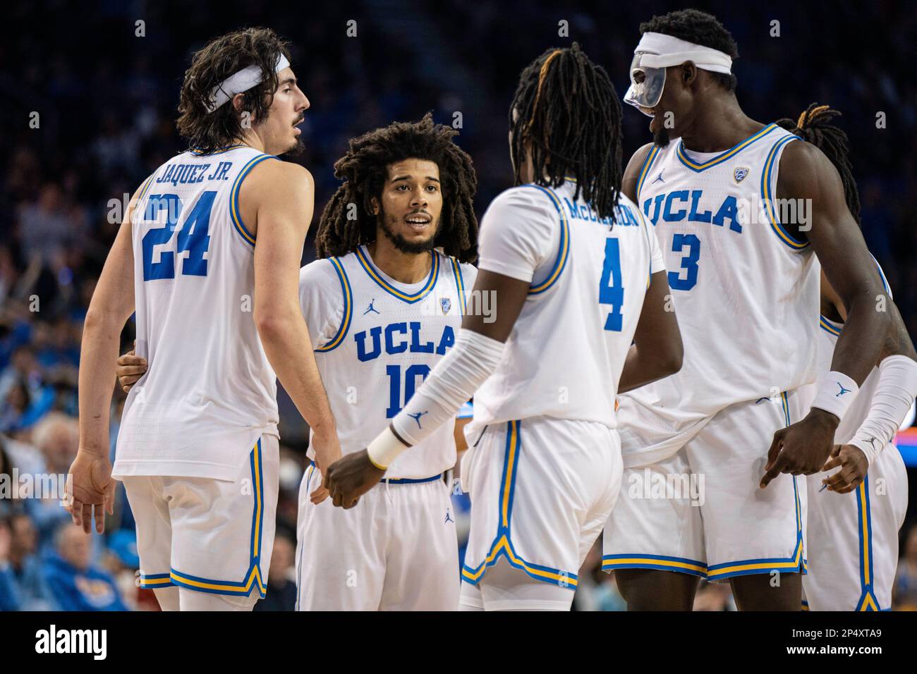 UCLA Bruins guard Tyger Campbell (10) speaks to teammates guard Jaime ...