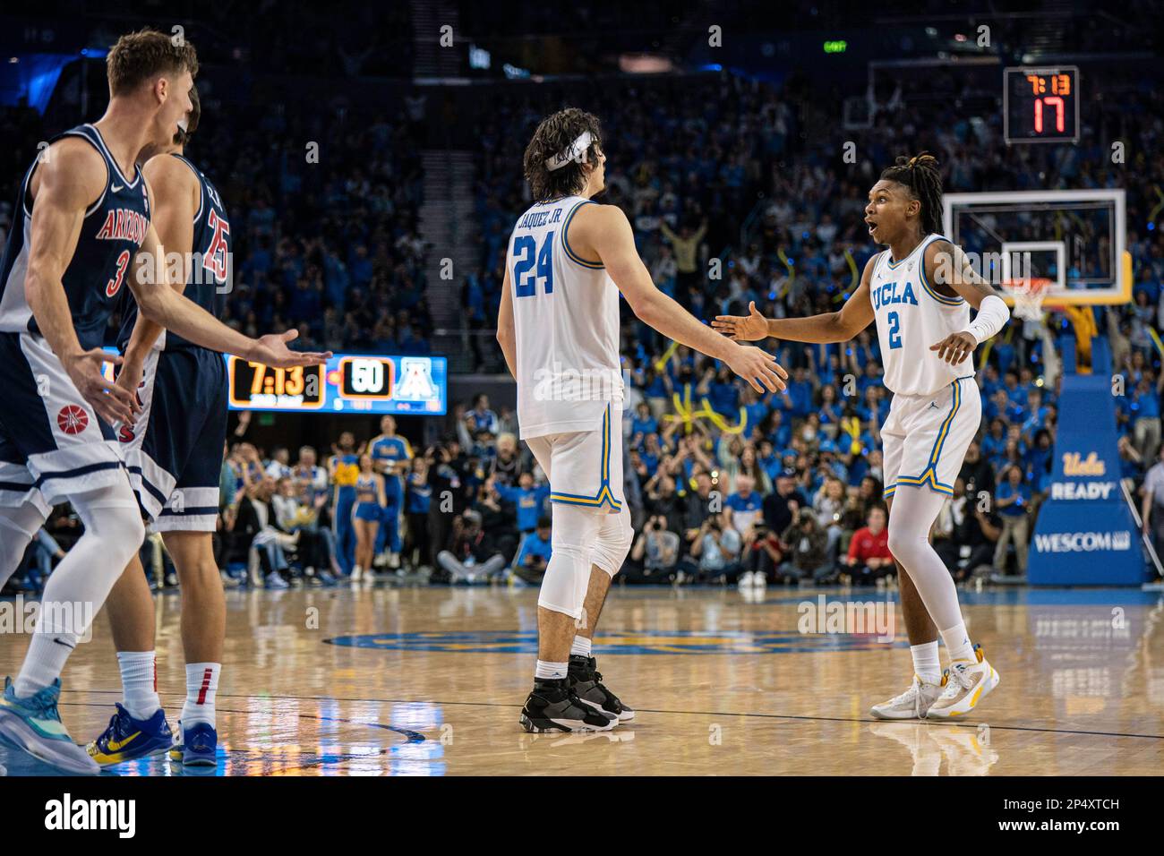 UCLA Bruins guard Dylan Andrews (2) congratulates guard Jaime Jaquez Jr ...