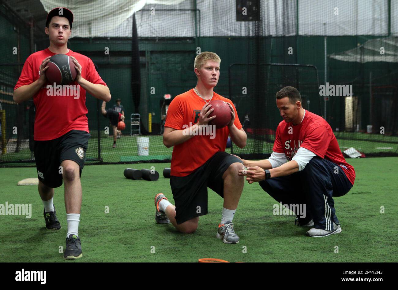 Tommy Zoellner,17, of O'Fallon, Mo., center, listens to strength and ...