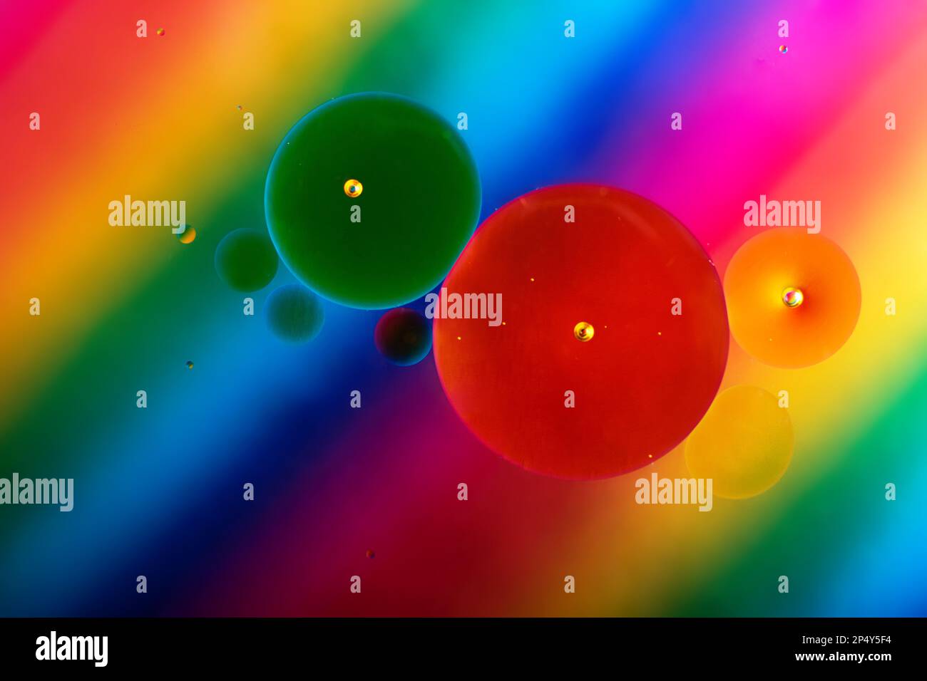 Macro photography of the oil drops on the water surface.Cosmic circles ...