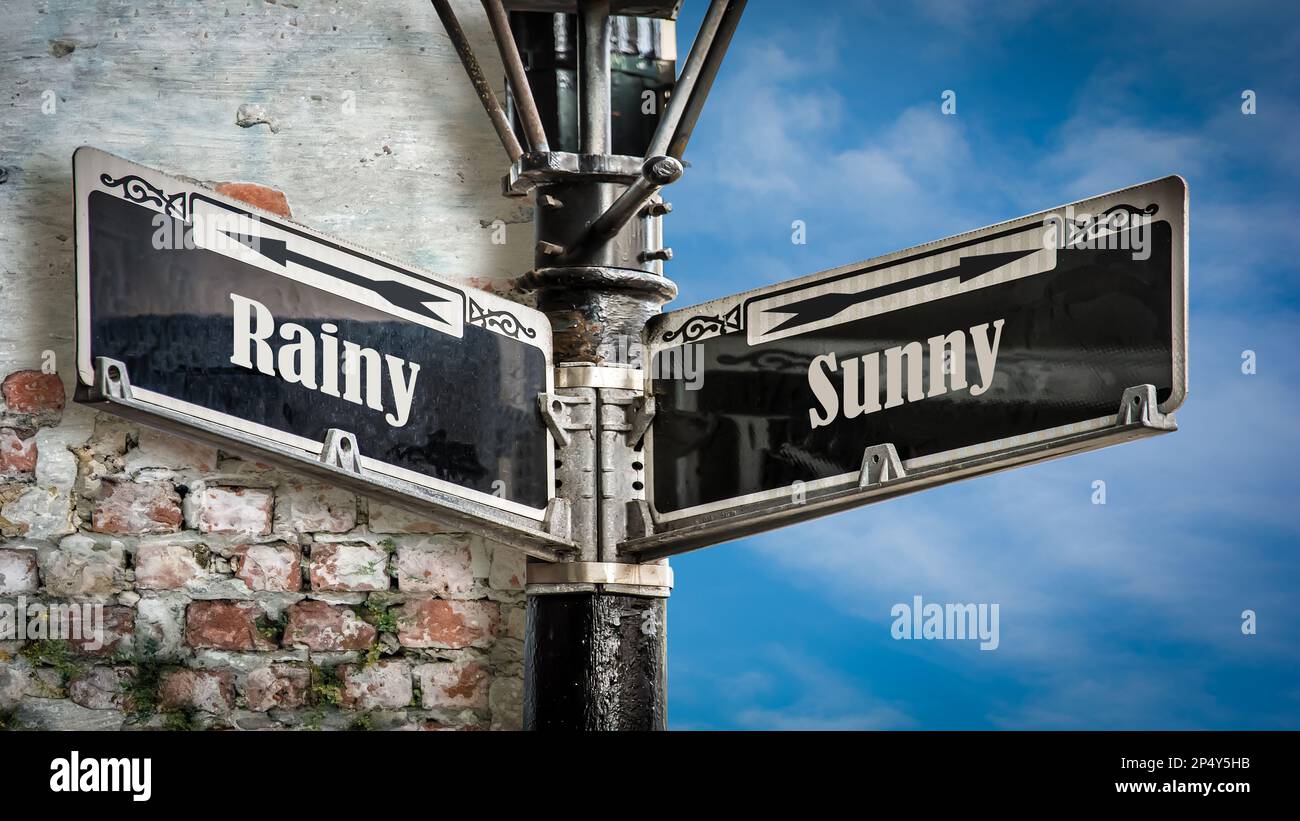 Street Sign the Direction Way to Sunny versus Rainy Stock Photo - Alamy