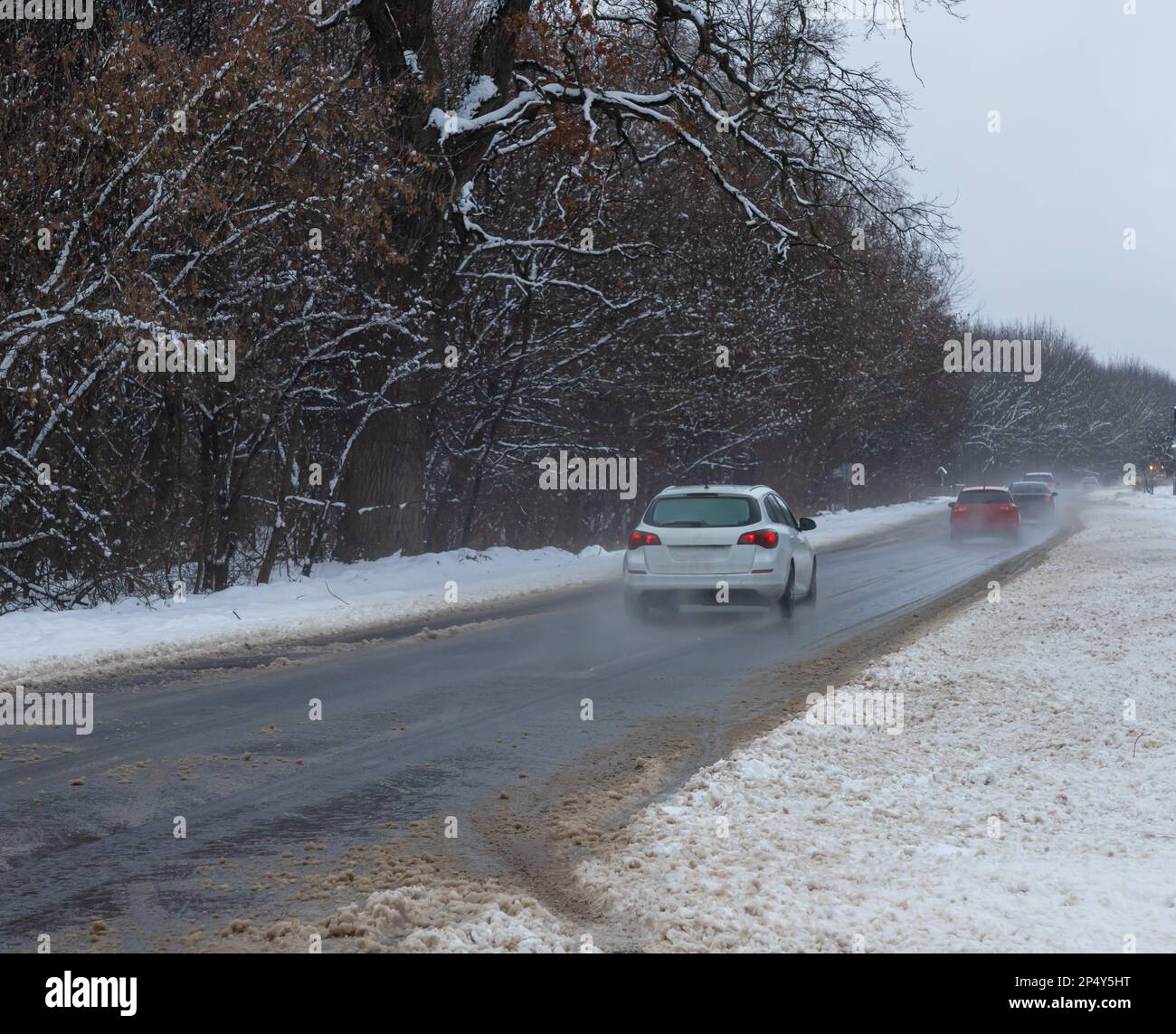 driving in winter after a snowfall, ice on the road, temperatures below ...