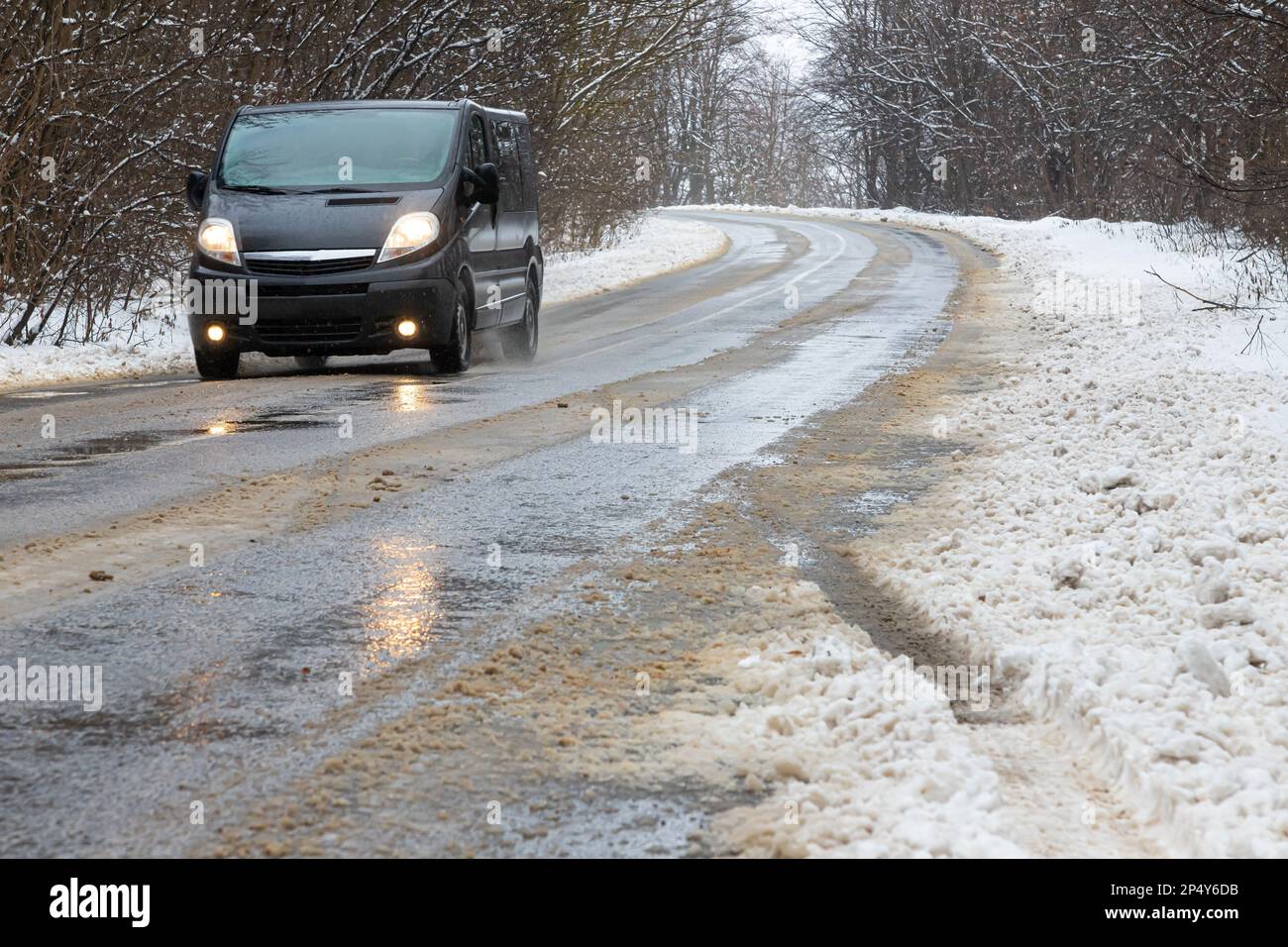 driving in winter after a snowfall, ice on the road, temperatures below ...