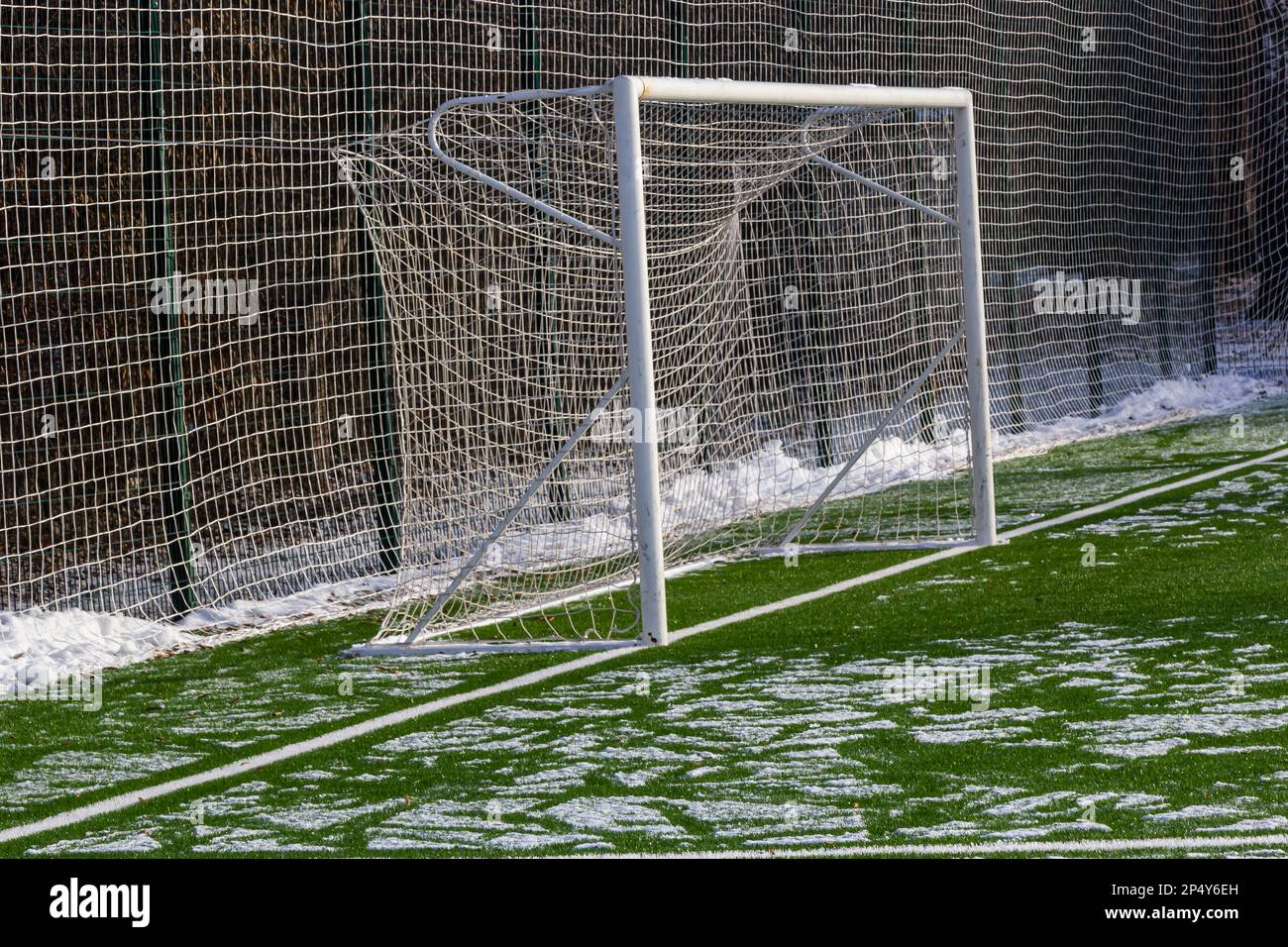 field for playing football in winter, artificial grass on cleared of ...