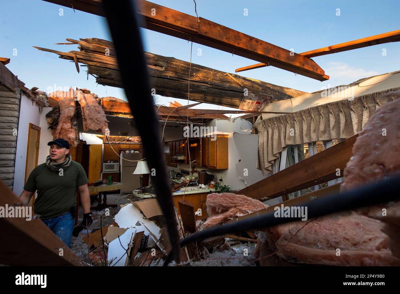 Dave Look hauls items out of the destroyed home of his grandparents ...