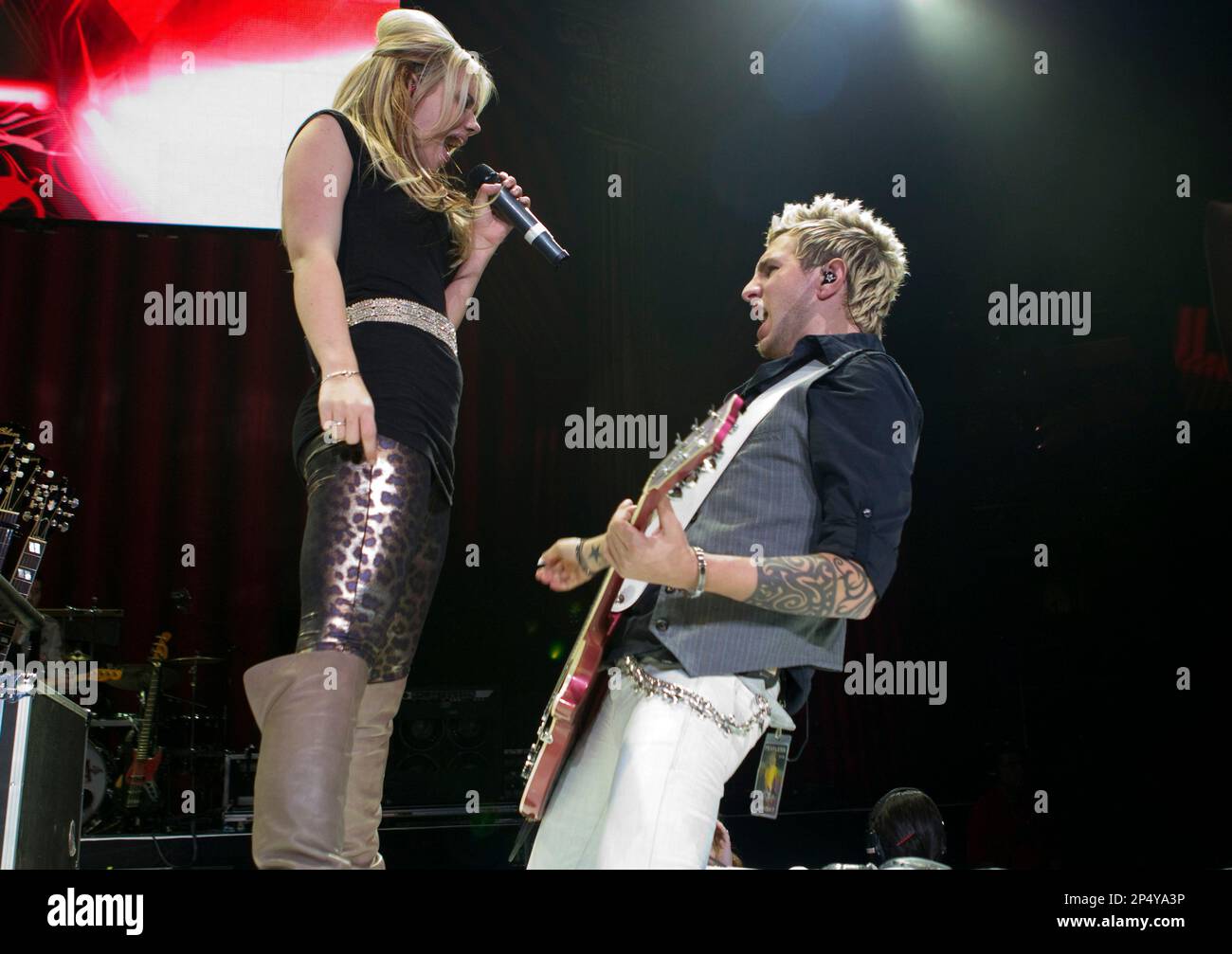 Cheyenne Kimball (L) and Mike Gossin of Gloriana perform on stage at ...