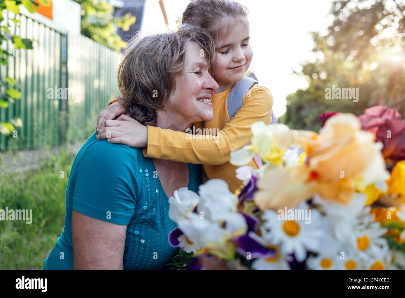 Cute Granddaughter Hugging Her Happy Grandmother The Hugs Of An
