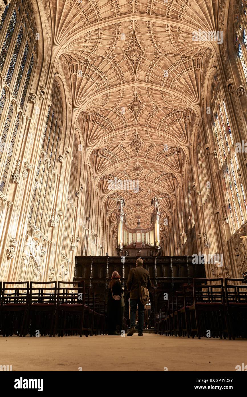 Tourists near the dark oak screen under the fan vaulted ceiling at the ...