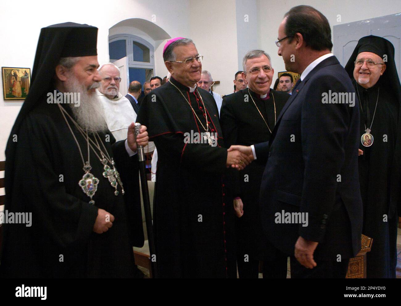 French President Francois Hollande, second right, shakes hands with ...