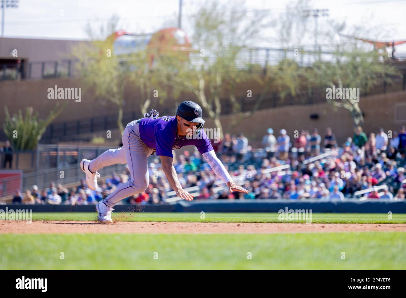 Alan Trejo (INF) sliding into third base during a MLB spring training ...