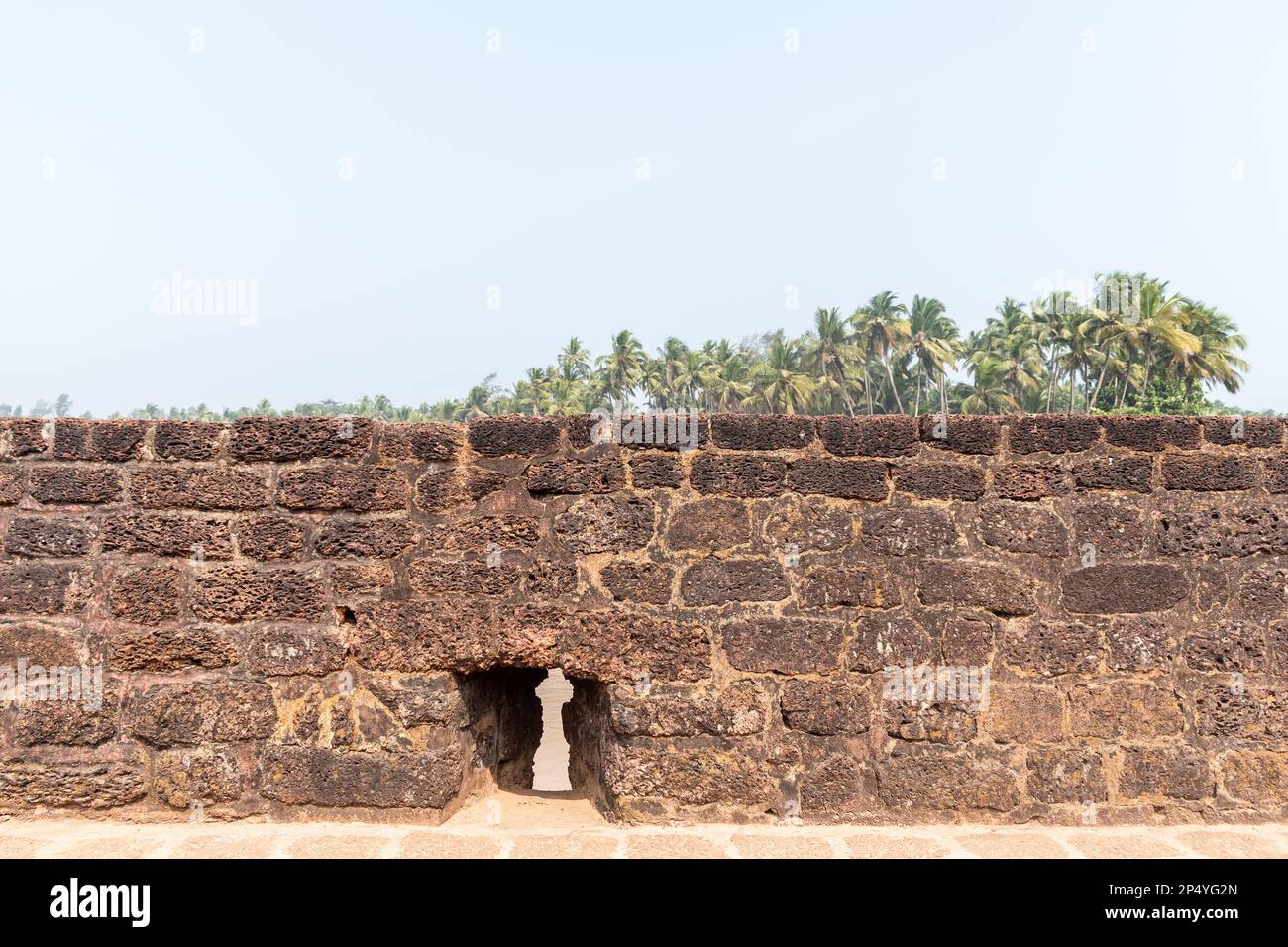 The laterite brick wall of the ancient Portuguese era Fort Aguada in ...
