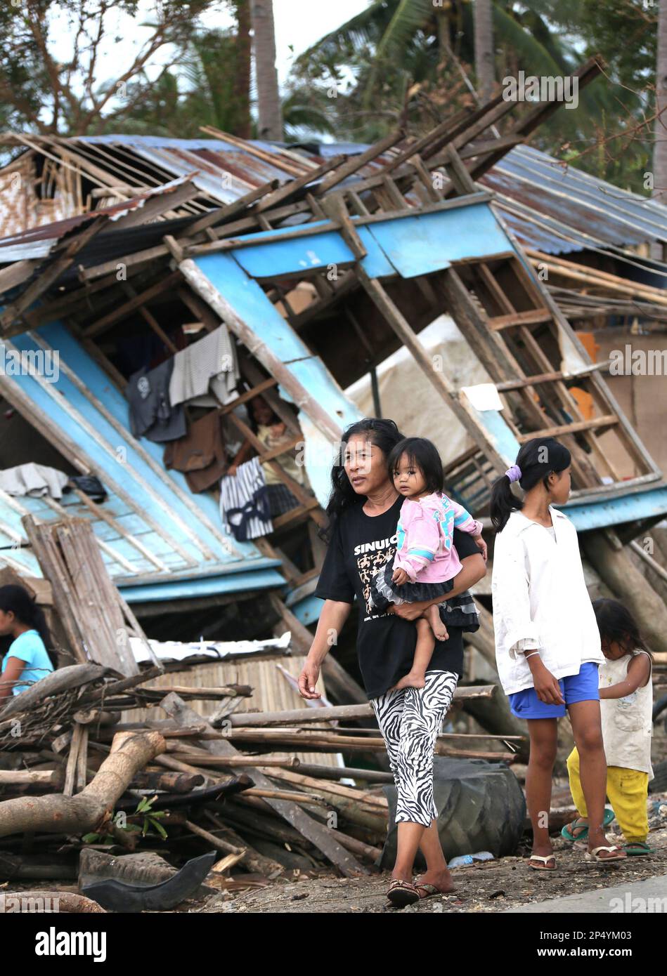 Residents return to their damaged house in Cebu Island, the Philippines ...