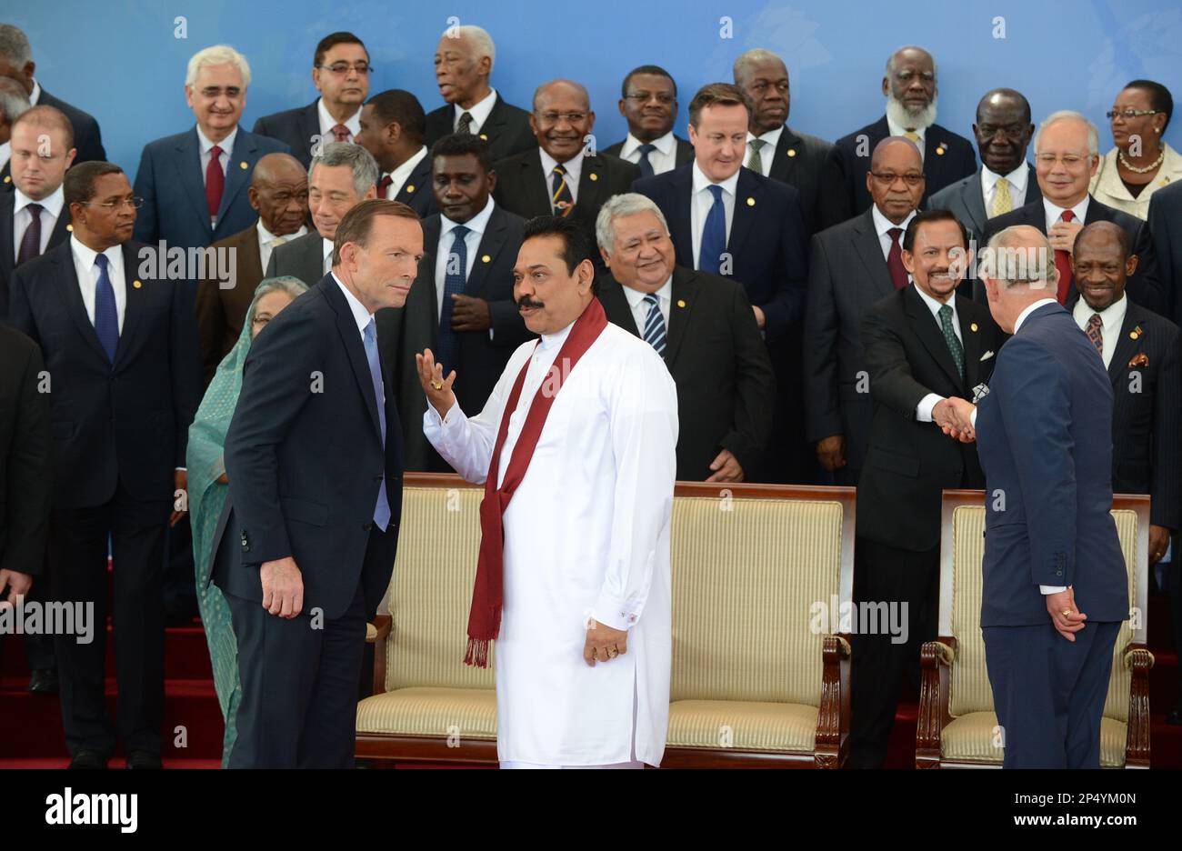 Australian Prime Minister Tony Abbott, left, talks to Sri Lankan ...