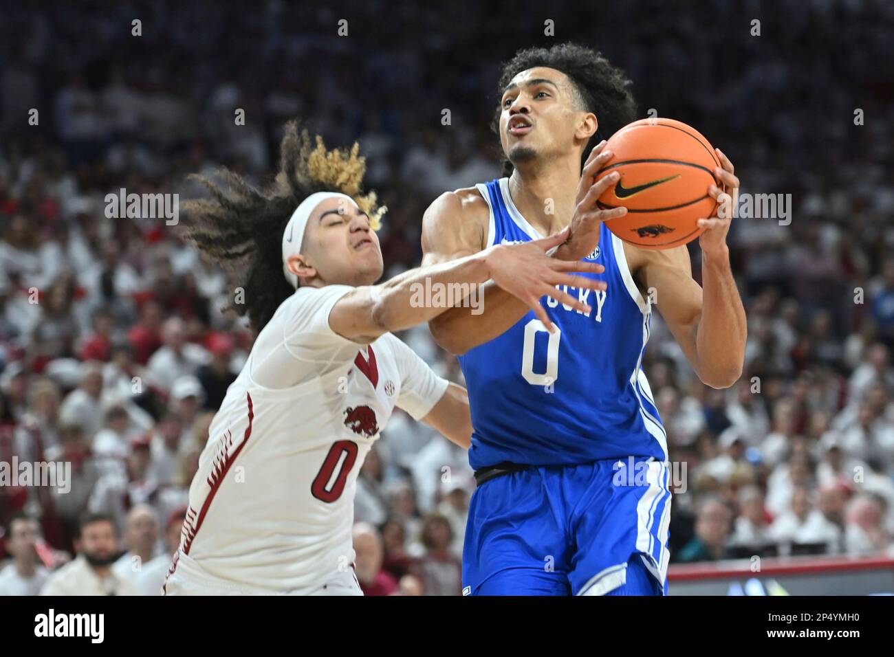 Kentucky forward Jacob Toppin, right, drives past Arkansas guard ...