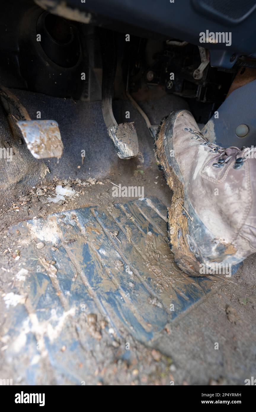 Close-up of a man's legs in military camouflage with trekking boots ...