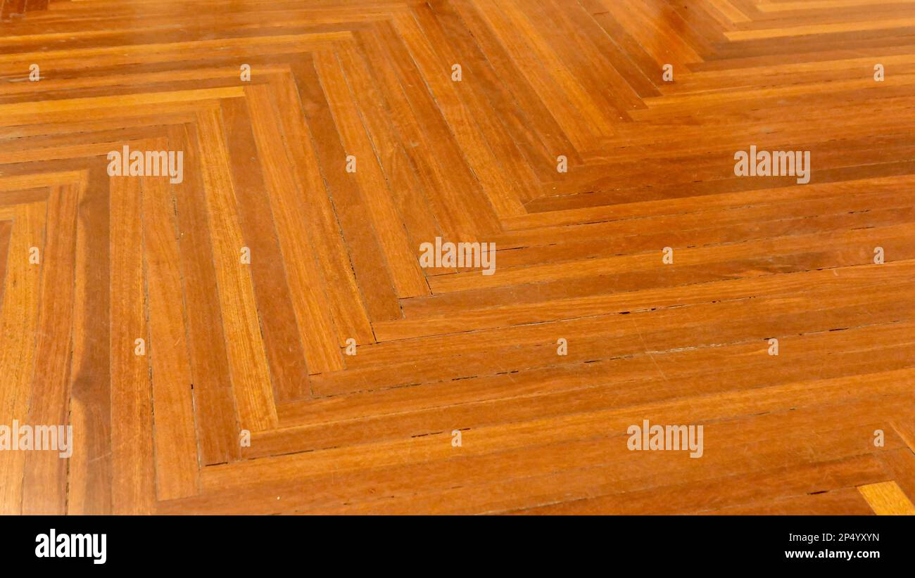 Full frame brown long plank herringbone wood background with copyspace ...