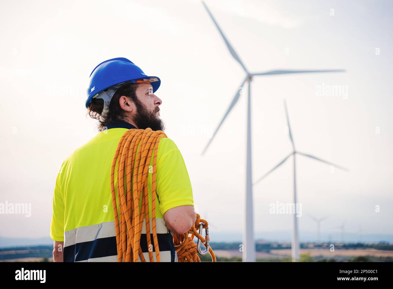 Man climbing wind turbine man wind farm hi-res stock photography and ...