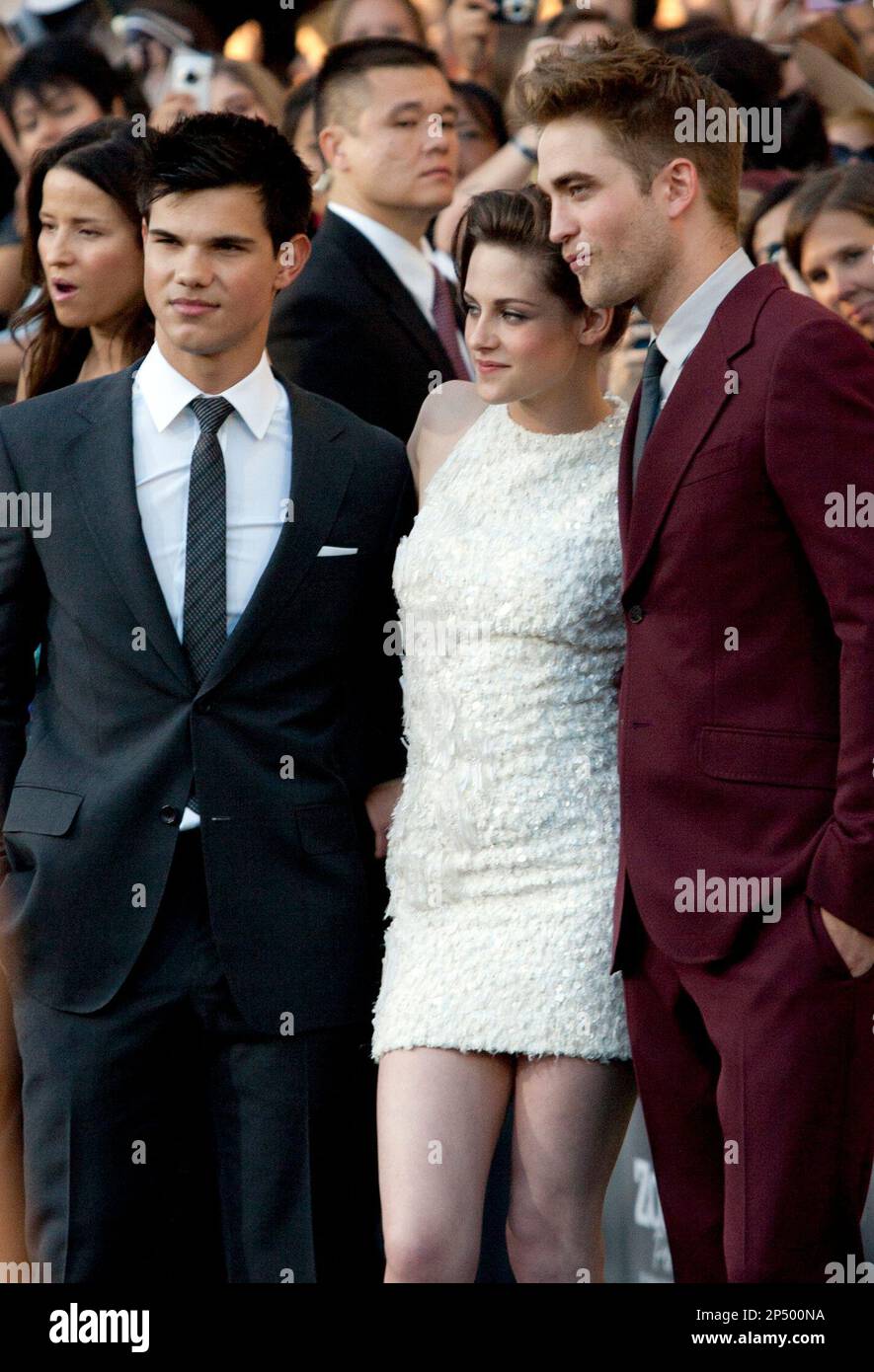 (L-R) Robert Pattinson, Kristen Stewart, and Taylor Lautner arrive for ...