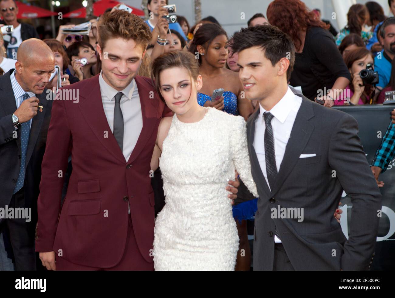 (L-R) Robert Pattinson, Kristen Stewart, and Taylor Lautner arrive for ...