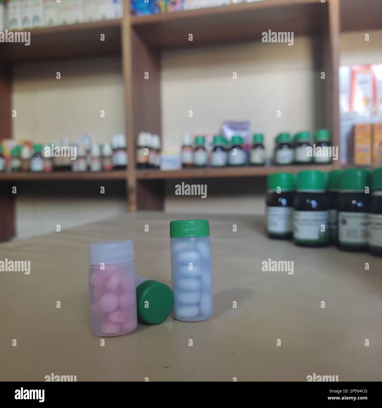 Homeopathic medicine consisting of the pills and a bottle containing a ...