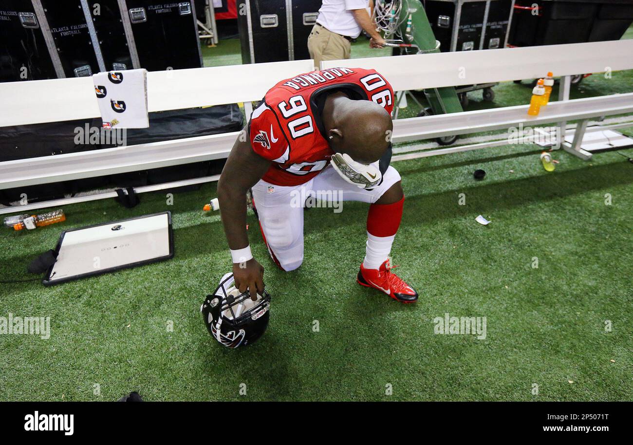 Atlanta Falcons defensive end Stansly Maponga kneels on the side line ...