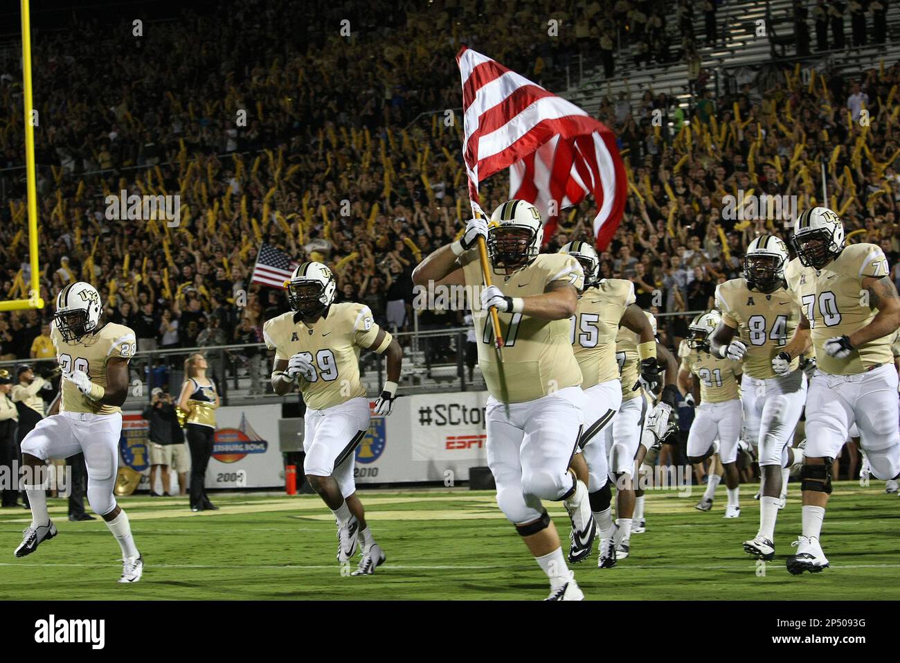 UCF Knights offensive linesman Kelly Davison (77) carries an American ...